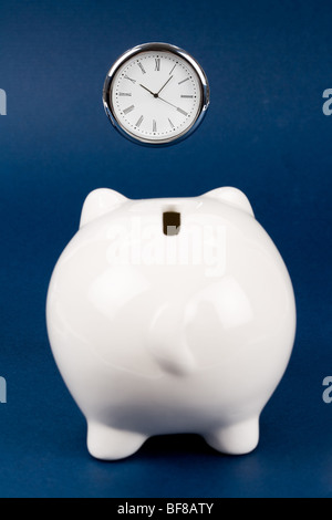 Piggy Bank and clock, Business concept Stock Photo - Alamy
