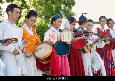Madeiran children in traditional costume playing musical instruments ...