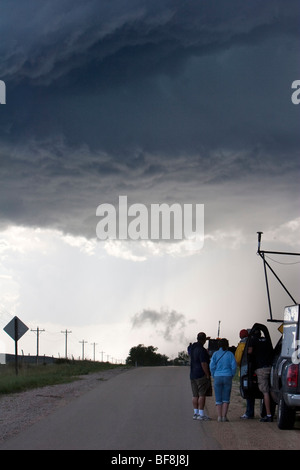 Scientists participating in Project Vortex 2 park along a road to ...