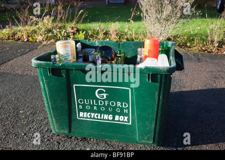 Green kerbside recycling boxes for glass and food waste waiting for ...