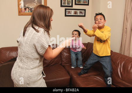 Mum fighting with kids Stock Photo - Alamy