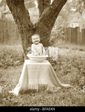 table with white tablecloth under a tree Stock Photo - Alamy