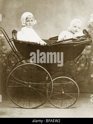 Two girls in baby carriage Stock Photo - Alamy