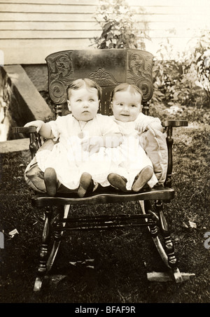 A chair rocking in the middle of the old mystical attic. Sunlight ...