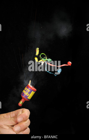 Party popper popping Stock Photo - Alamy