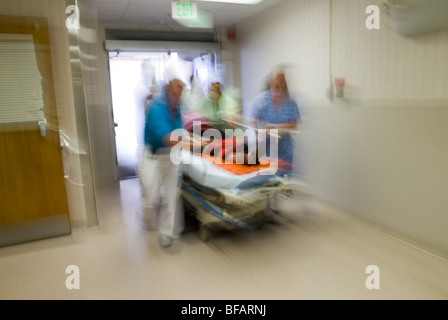 Emergency room, EMTs rush patient to operating room Stock Photo - Alamy