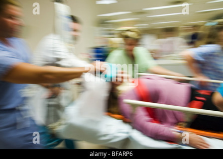 Emergency room, EMTs rush patient to operating room Stock Photo - Alamy