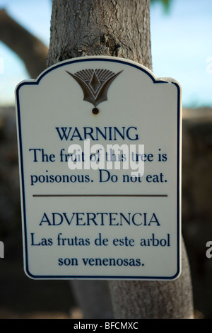 A warning sign on a poisonous plant Stock Photo - Alamy