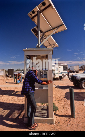 Solar-powered telephone box. Public telephone with a solar panel. These ...
