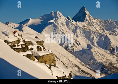 A snowboarder catching some air at Rogers Pass, Glacier National Park ...