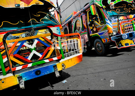 Tap-tap buses passing through the downtown of Port-au-Prince. Tap-tap ...