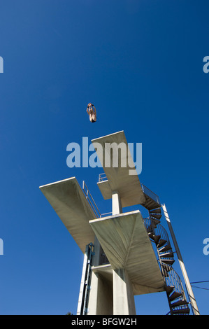 Swimmer diving from diving board Stock Photo - Alamy