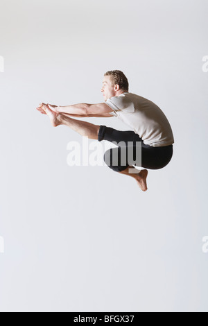 Ballet dancer leaping in mid-air Stock Photo - Alamy