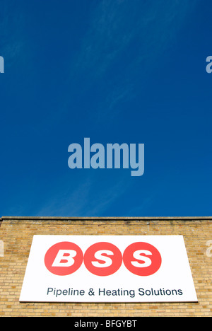 sign with logo for bss pipeline and heating solutions on a brick wall ...