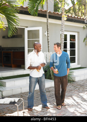 Two men in their 20s having a meeting Stock Photo - Alamy