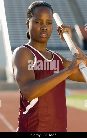 Female athlete preparing for pole jump Stock Photo - Alamy