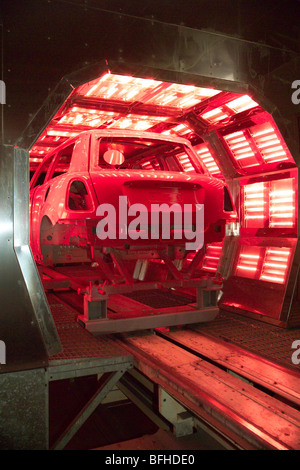 Car body entering a paint drying oven in a car assembly plant Stock ...