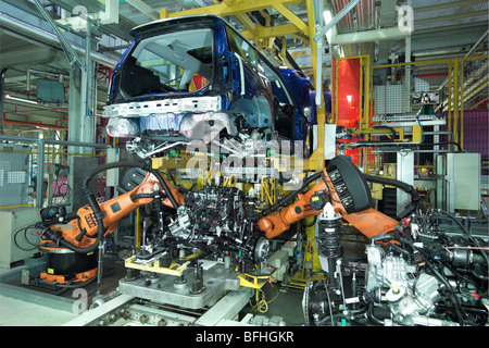 Robotic engine fitting in a car assembly plant Stock Photo - Alamy