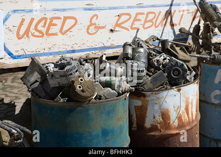 Rusty sign and barrels in junkyard Stock Photo - Alamy