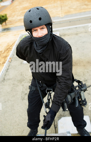 SWAT Team Officer Rappelling from Building Stock Photo - Alamy