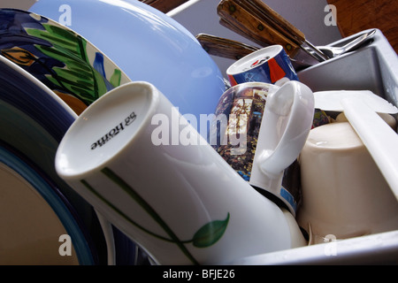 The clean dishes drying after washing Stock Photo - Alamy