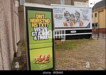 Titan bilingual Welsh English language billboard showing coal miners ...