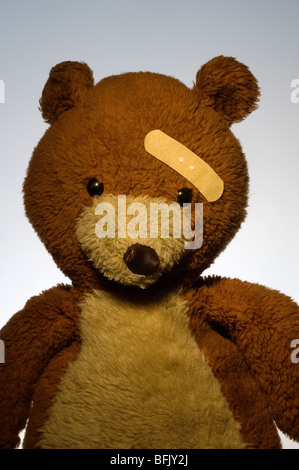 Teddy bear with a band aid on his head Stock Photo: 32144422 - Alamy