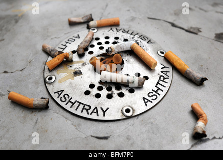 Old stale cigarette butts in a cigarette waste bin in Brighton Stock ...
