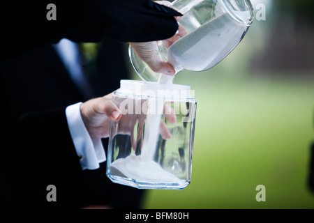 Hand Pouring Sand Stock Photo - Alamy