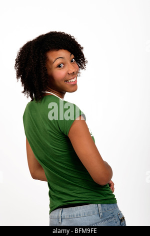 Beautiful young happy woman with fresh broccoli on beige background ...
