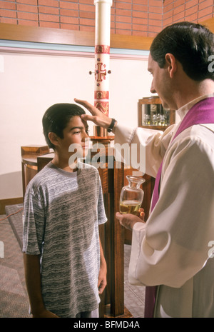 bless holy oil confirmation Stock Photo - Alamy