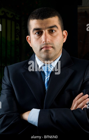 Businessperson with folded arms Stock Photo - Alamy