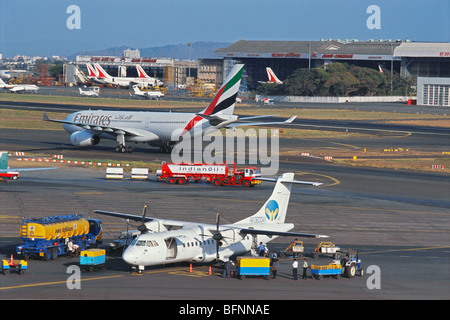 Emirates airplane refueling at airport runway Stock Photo - Alamy