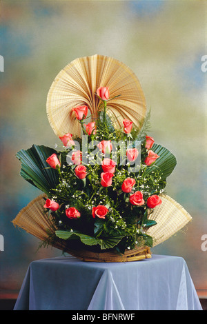 flower arrangement on table. Bouquet of roses in a paper box. vase in ...