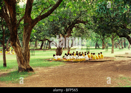 Group of children studying under a tree in a rural school Stock Photo ...