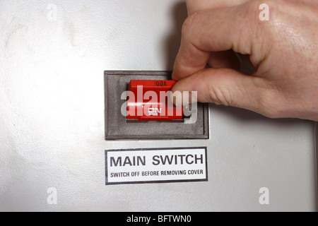 Switching off main electrical switch at distribution board Stock Photo ...