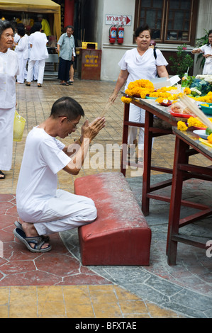 Chinese people pray at a temple during Lunar New Year celebrations at ...