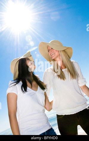 WOMEN IN HATS IN FRONT OF THE BEACH OF PERROS-GUIREC, COTE DE GRANIT ...