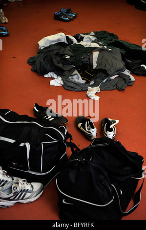 A footballers changing room with dirty kit piled on the floor UK Stock ...