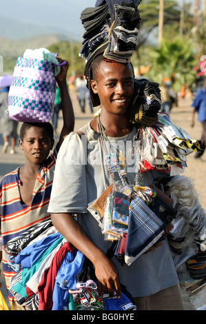 Happy African street vendor hawker village , woman with short hair ...