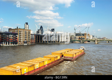 A barge with a cargo load on the Thames in Central London, UK Stock ...