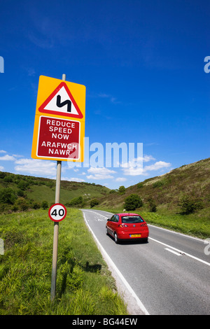 Bilingual Welsh road sign, (reduce speed now) Wales, UK Stock Photo - Alamy