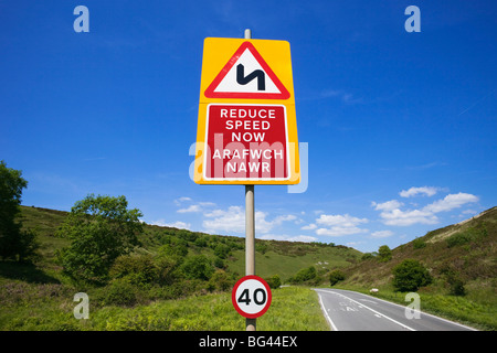 Bilingual Welsh road sign, (reduce speed now) Wales, UK Stock Photo - Alamy