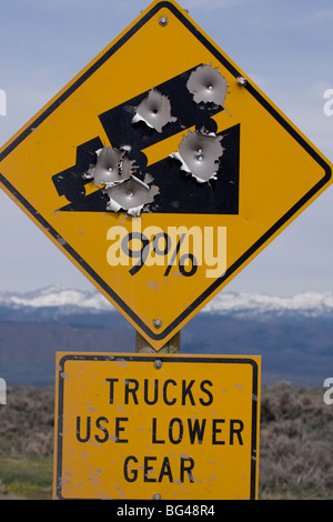 Bullet holes in road sign Crete Stock Photo - Alamy