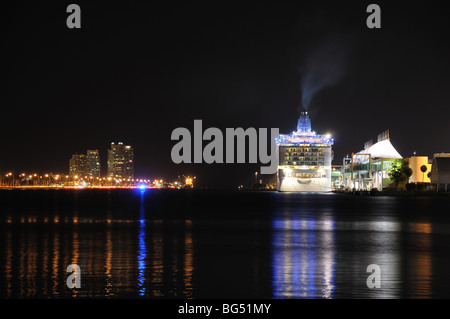 Miami night. Cruise ship in the Port of Miami at sunset with multiple ...