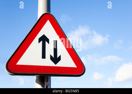 uk road sign arrows two way traffic crossing ahead Stock Photo ...