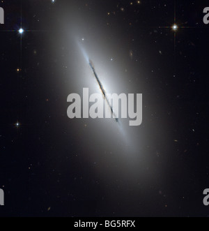 NGC 5866 is an edge-on galaxy that is tilted to our line-of-sight. It ...