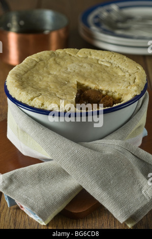 A classic English dish of Steak and Kidney Suet Pudding served with ...