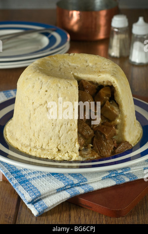 Steak and kidney suet pastry pudding - white background Stock Photo - Alamy