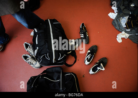 A footballers changing room with dirty kit piled on the floor UK Stock ...